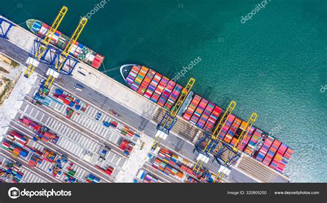 container ship loading and unloading in deep sea port aerial to