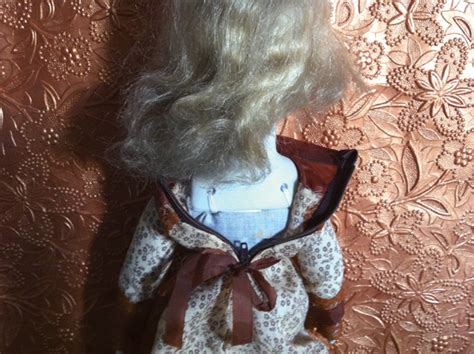 Blond Haired Porcelain Bisque Doll In Brown Calico Dress Unknown Age