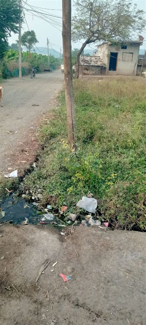 Dirty Water Flowing On The Road Due To Drains Not Being Cleaned