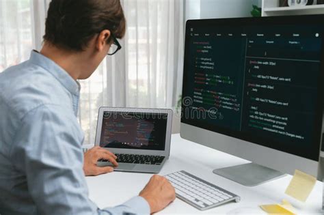 it developer working online software on laptop comparing with pc