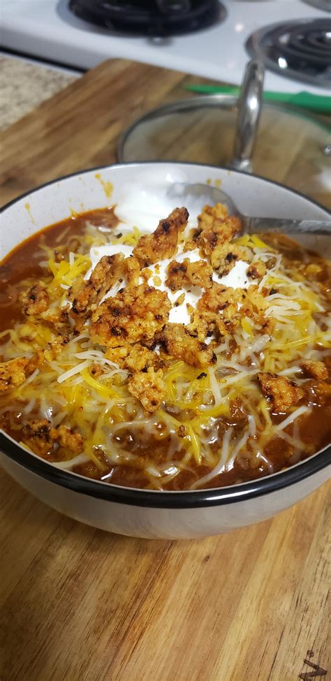 Spicy Keto Chili W Shredded Cheese Sour Cream And Crushed Parmesan