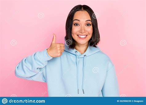 Photo Of Pretty Confident Girl Dressed Blue Sweatshirt Smiling Showing