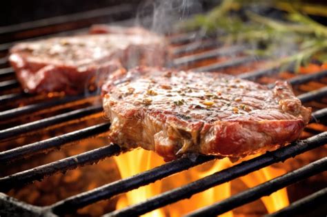 Sizzling Ribeye Steak On A Grills Hot Surface Stock Image Image Of