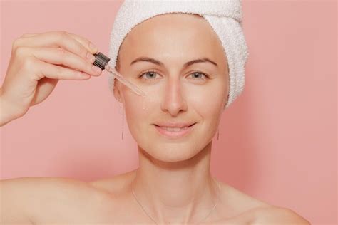 Premium Photo Portrait Of A Girl Dripping Oil On The Skin Of Her Face