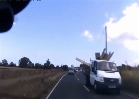Video Wood Flies Off Truck And Crashes Through Oncoming Cars Windshield