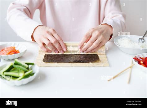 Sushi Preparation Process The Girl Makes Sushi With Different Flavors Fresh Salmon Caviar