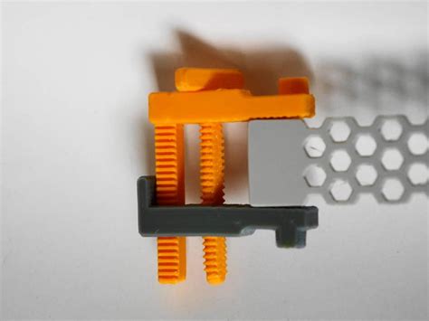 Clamp With Counter Locking Rail And Horizontal Printed Screw For