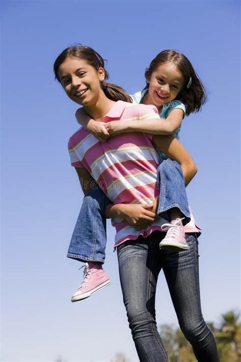 Two Girls In Park Giving Each Other Hug Stock Image Image Of
