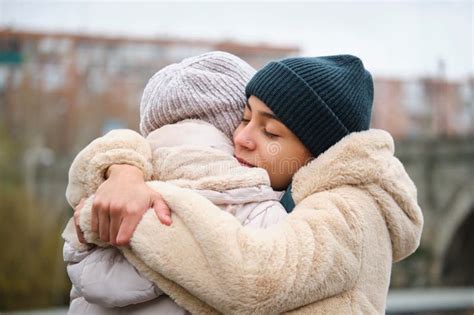 Dominican Lesbian Couple Hugging With Affection And Love At Street In
