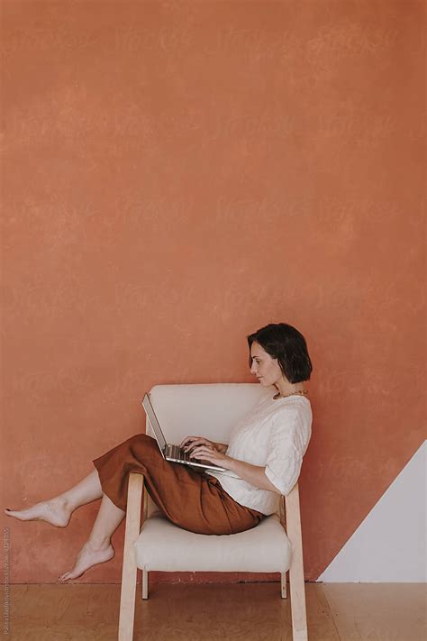 Business Woman Working At Laptop By Stocksy Contributor Palina