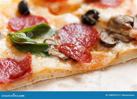 A Hot Pizza Slice With Dripping Melted Cheese Isolated On White Stock