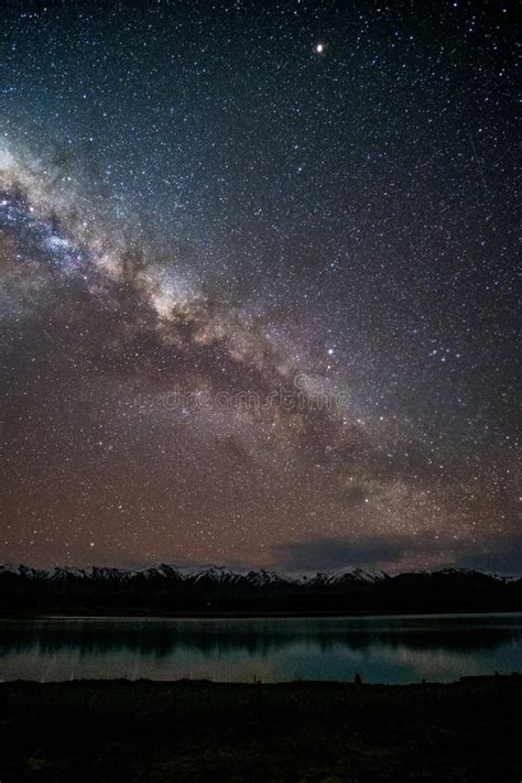 Beautiful Milky Way Starry Night Over The Snow Mountain At Lake Pukaki