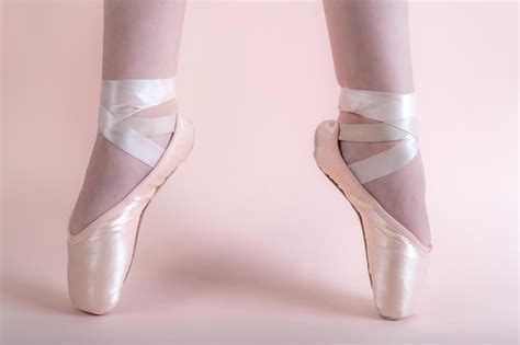 Premium Photo Young Ballerina On Pink Ballet Pointe Shoes Legs Second