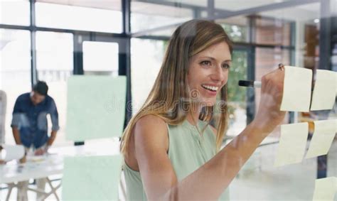 Bold Ideas Are What Youll Get From Her A Young Businesswoman Brainstorming With Notes On A