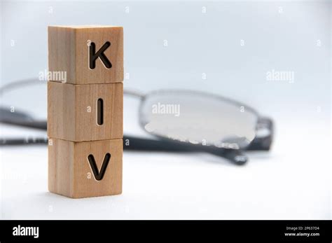 kiv text engraved on wooden blocks with white cover background keep in