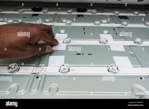Fixing Broken LED Lights Of A LCD Display Television Screen Stock Photo