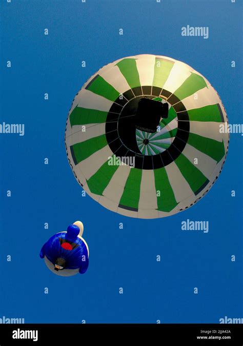 A Vertical Low Angle Shot Of Air Balloons At The International Balloon