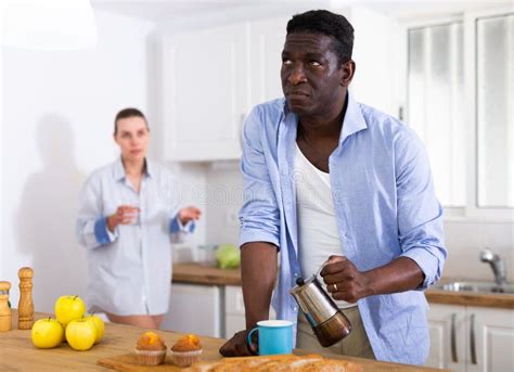 Domestic Quarrel Of Husband And Wife In Kitchen During Breakfast Stock