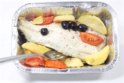 Baked Sea Bass Fillet With Potatoes And Rotisserie Cherry Tomatoes