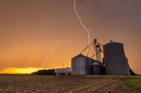 Premium Ai Image Lightning Shooting Out Of An Orange Sky At Dusk With