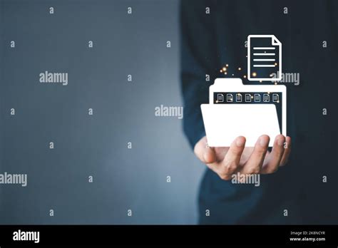 Document Management System DMS Folder Icon On Hand Of Businessman