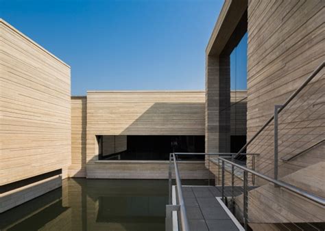 Mu Xin Art Museum By OLI Architecture Sits Over A Lake