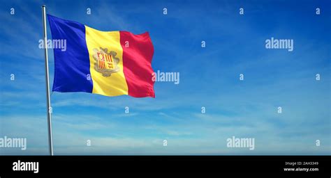 The National Flag Of Andorra Blowing In The Wind In Front Of A Clear