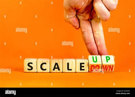 Scale Up Or Down Symbol Concept Words Scale Up Scale Down Wooden Cubes Businessman Hand