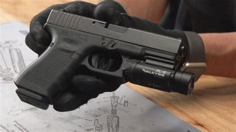 Simple Sleek Powerful OLight Weapon Mounted Flashlight PL 2