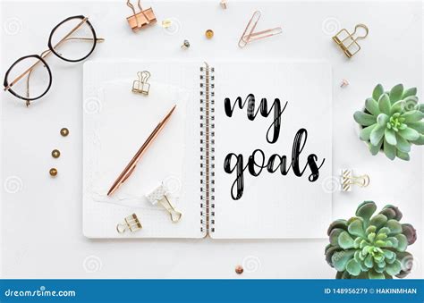 My Goal Concepts With Text On Notepad With Accessories On White Desk
