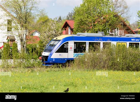 Train Of The Bayerische Regiobahn BRB Gliding Through The Town Of