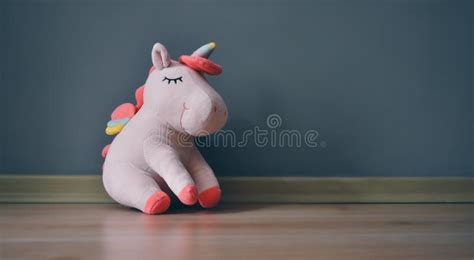 Cute Soft Unicorn Plush Toy On The Floor Close Up Shot Empty Space