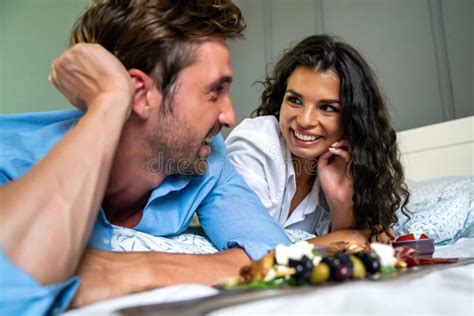 Portrait Of Happy Couple Enjoying Sensual Moments Together With Food