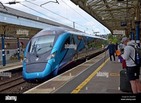 Passengers Waiting As A Trans Pennine Express Class 397 Nova 2 Train