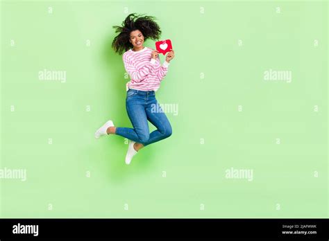 Full Length Body Size View Of Attractive Cheerful Trendy Girl Jumping