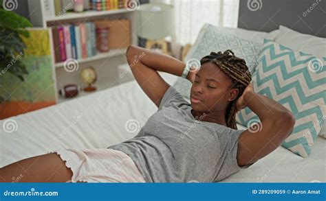 African American Woman Lying On Bed Relaxed At Bedroom Stock Video