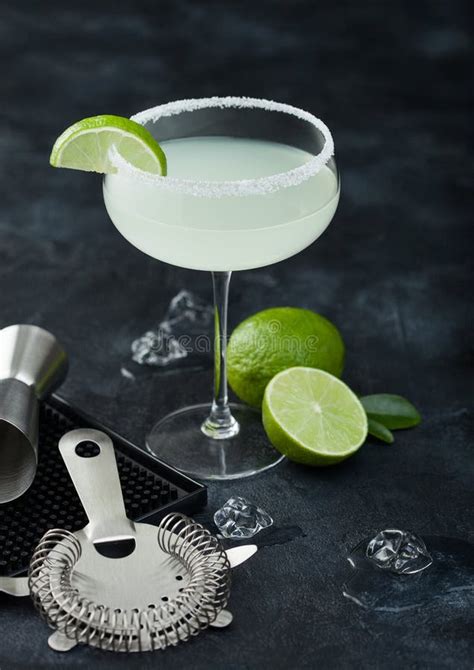 Luxury Glass Of Margarita Cocktail With Fresh Limes And Bar Mat With