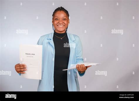 Beautiful African Travel Agent Holding A Travel Visa Application Form