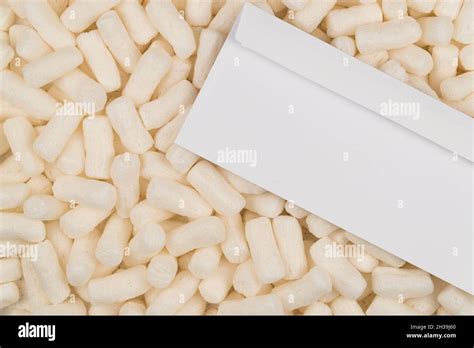 White Background Of Expanded Polystyrene Filler And Envelope Stock