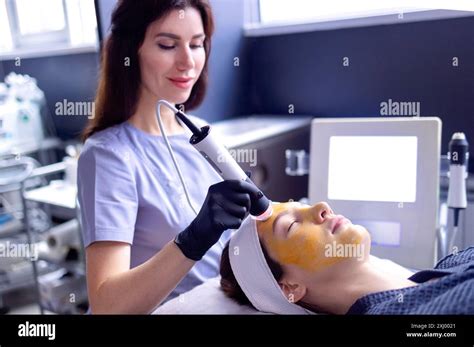Woman On Chemical Oxygenation Of Skin Due To Activation Of Biogel Cosmetologist Performs Oxygen