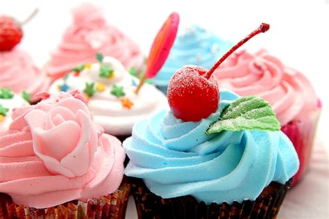 Premium Photo Colorful Cupcakes With Pink Frosting And Sprinkles