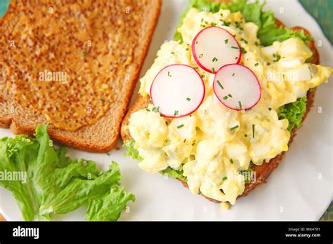 Egg Salad Sandwich On Whole Wheat Bread With Deli Mustard Lettuce