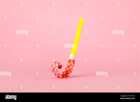 Birthday Whistle Over Pink Background Celebration And Party Concept