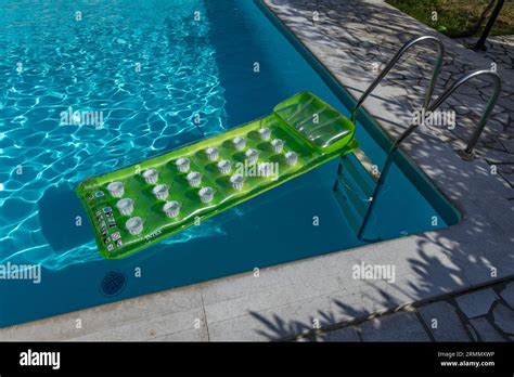 Resting By The Pool Inflatable Mattress On The Water In Croatia Stock