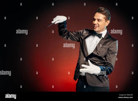 Professional Showman Wearing Suit Standing Isolated On Black And Red