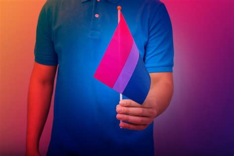 Premium Photo Hand Holding Flag In Bisexual Pride Colors