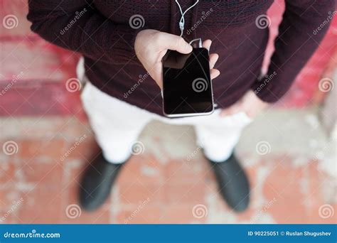 Hands Of Young Man Holding A Smartphone With Wires Stock Image Image