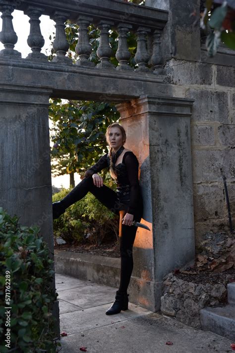 Full Length Portrait Of Beautiful Female Model With Blonde Plait