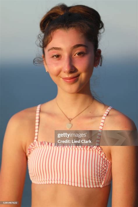 Portrait Of A Teenage Girl In Her Bathing Suit At The Beach High Res