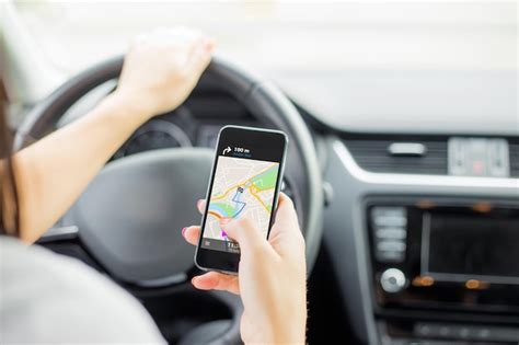 Premium Photo Driver Using Navigation App On Mobile Phone
